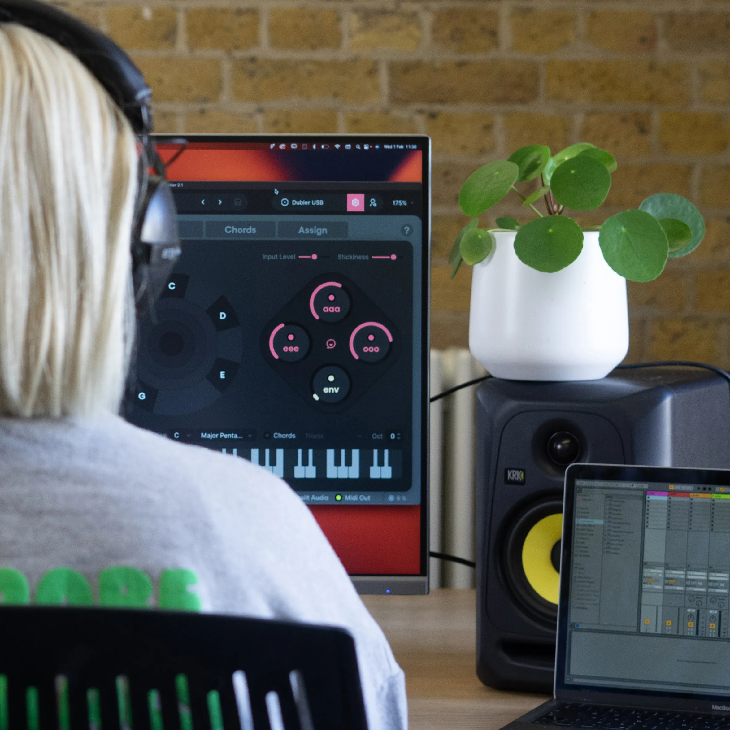 A woman sitting at a desk using Dubler 2